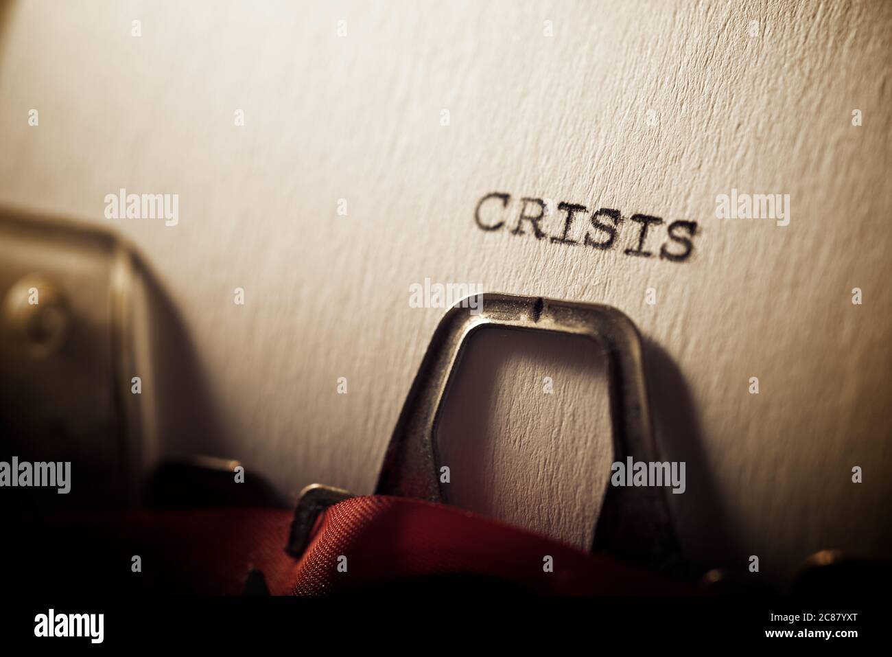 Crisis word written with a typewriter Stock Photo - Alamy