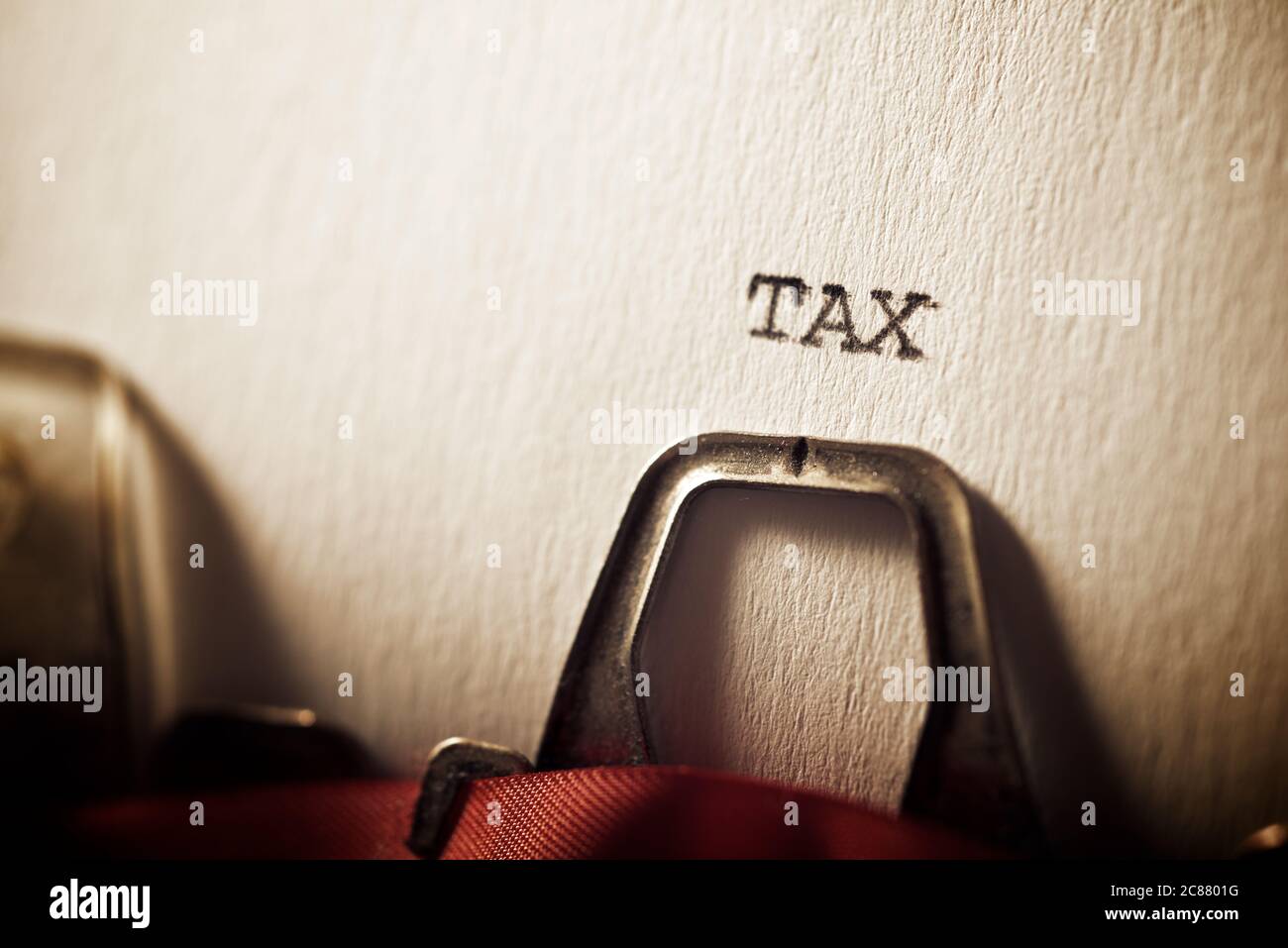 Tax word written with a typewriter Stock Photo - Alamy