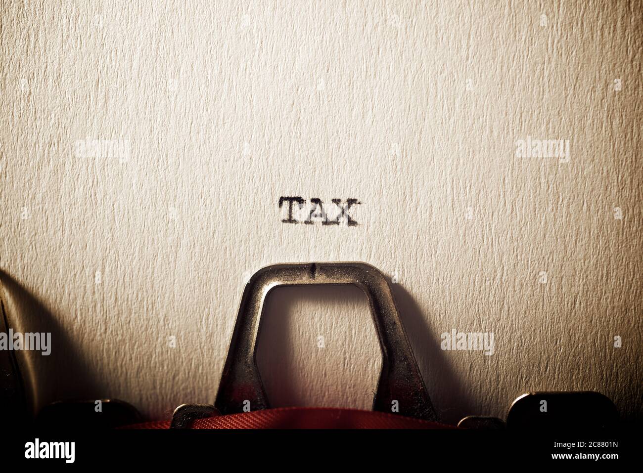 Tax word written with a typewriter Stock Photo - Alamy