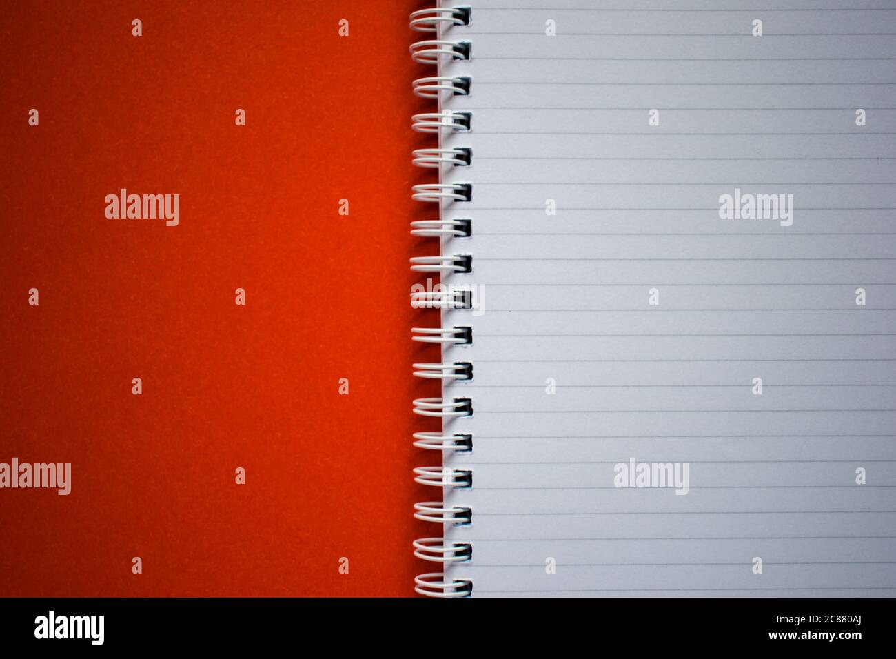 Cut out white notepad on orange background Stock Photo - Alamy
