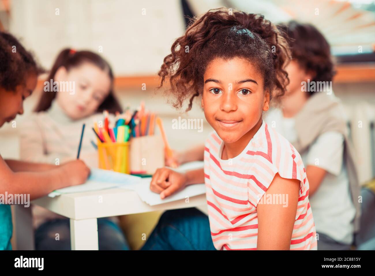African-American girl taking an art class at school Stock Photo - Alamy