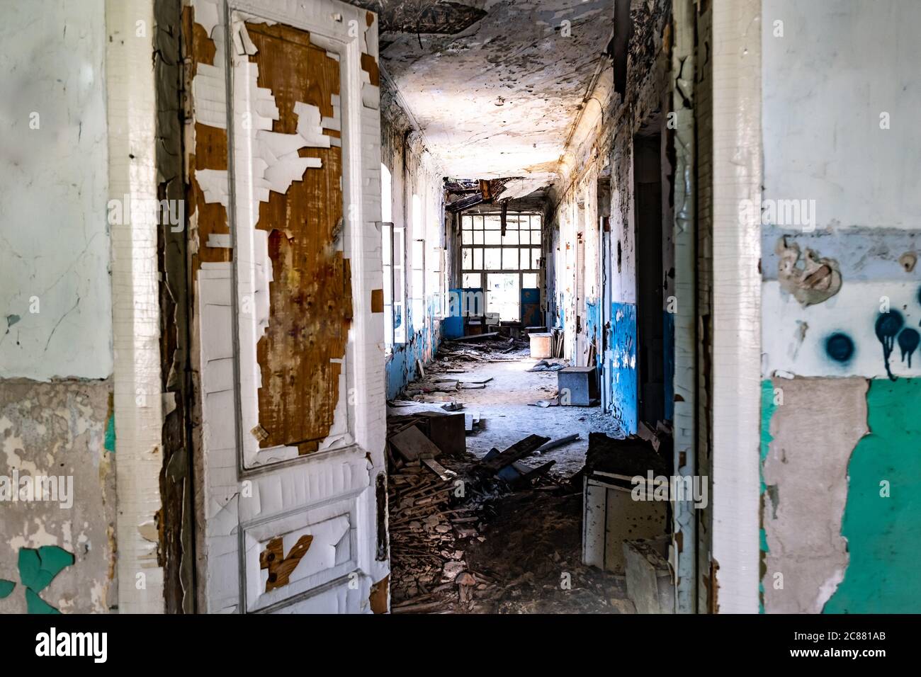 Ruined corridor with piles of garbage in abandoned asylum Stock Photo ...