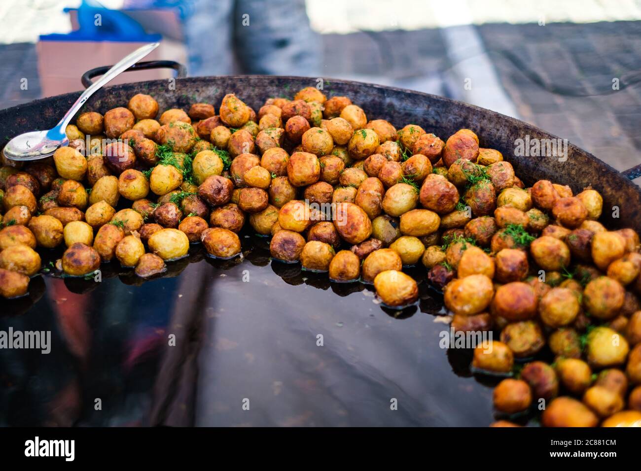 Fried potatoes in big pan, street food Stock Photo - Alamy