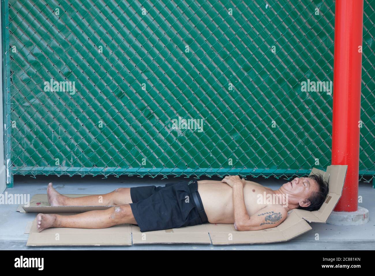 Homeless chinese man sleeping on a cardboard, Singapore a first world ...