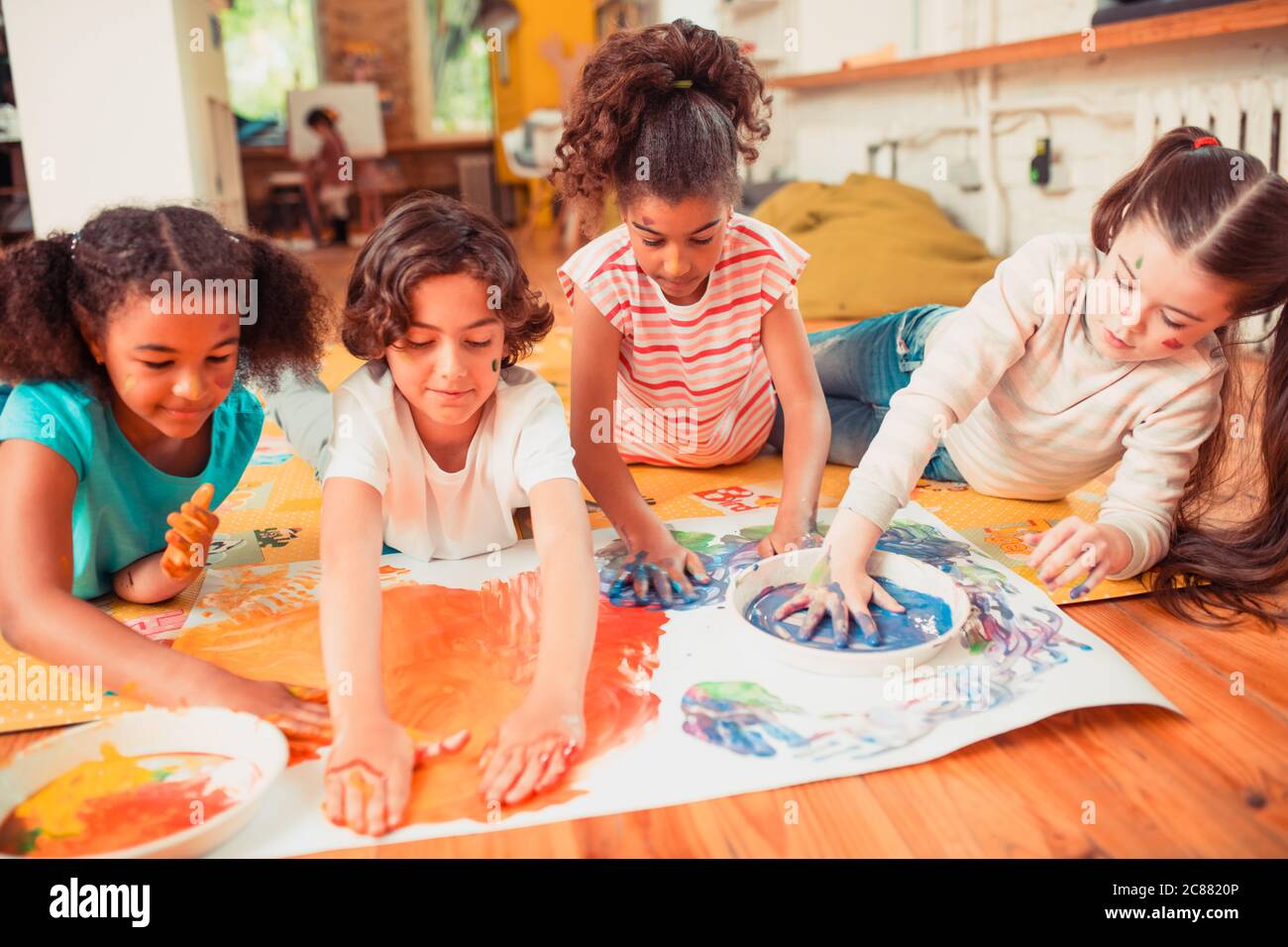 Children creating a bright picture with their hands Stock Photo - Alamy