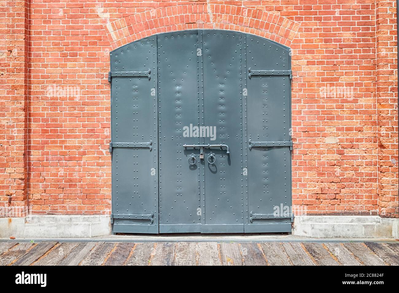 Texture of brick wall with door for background Stock Photo - Alamy