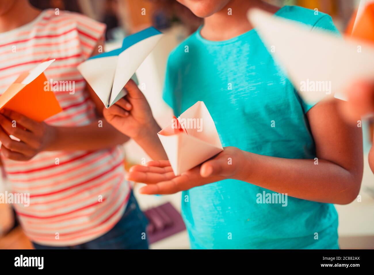 African school children holding paper hi-res stock photography and ...