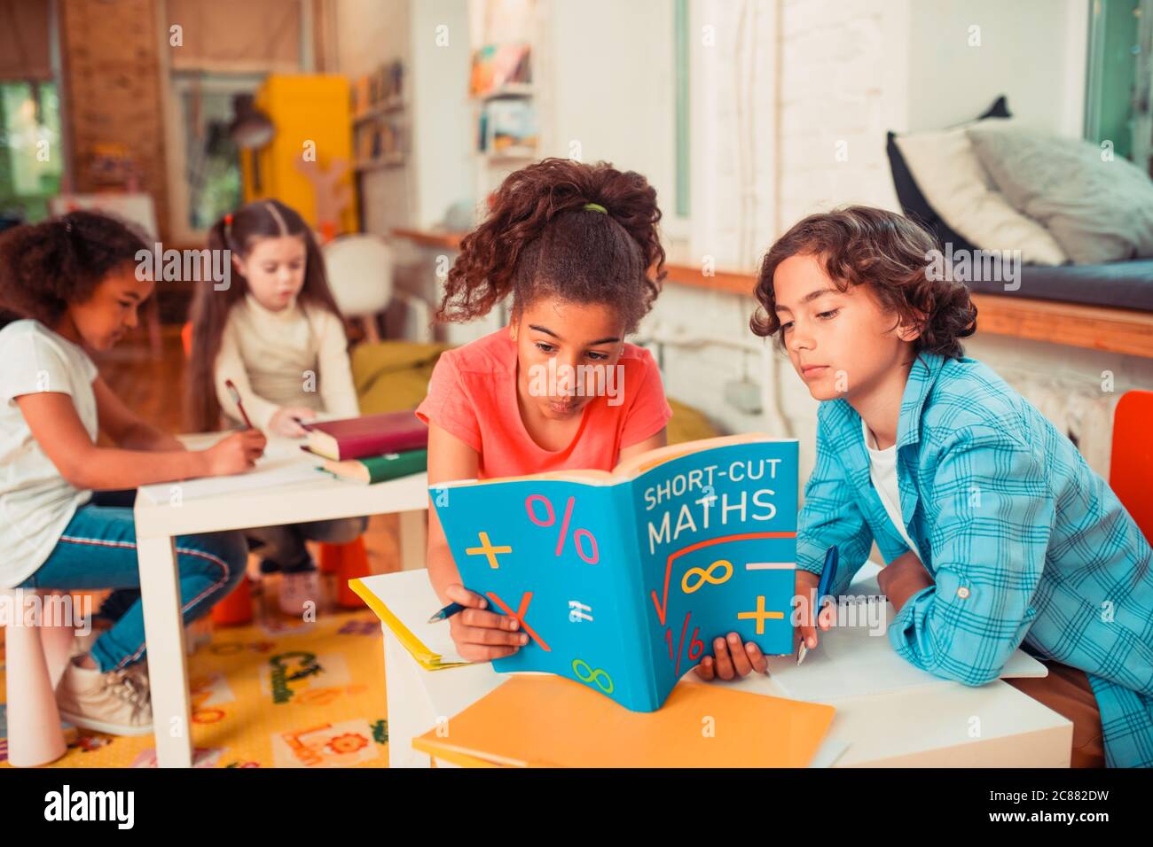 Solving an assignment hi-res stock photography and images - Alamy