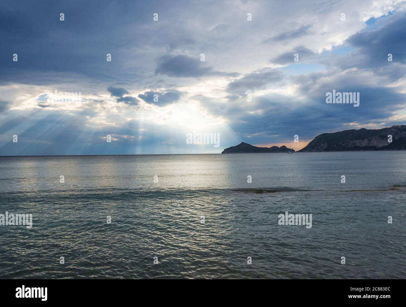 mediterranean sea and sky with dramatic clouds with sun rays beams and ...