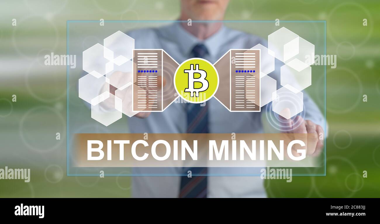 Man touching a bitcoin mining concept on a touch screen with his ...