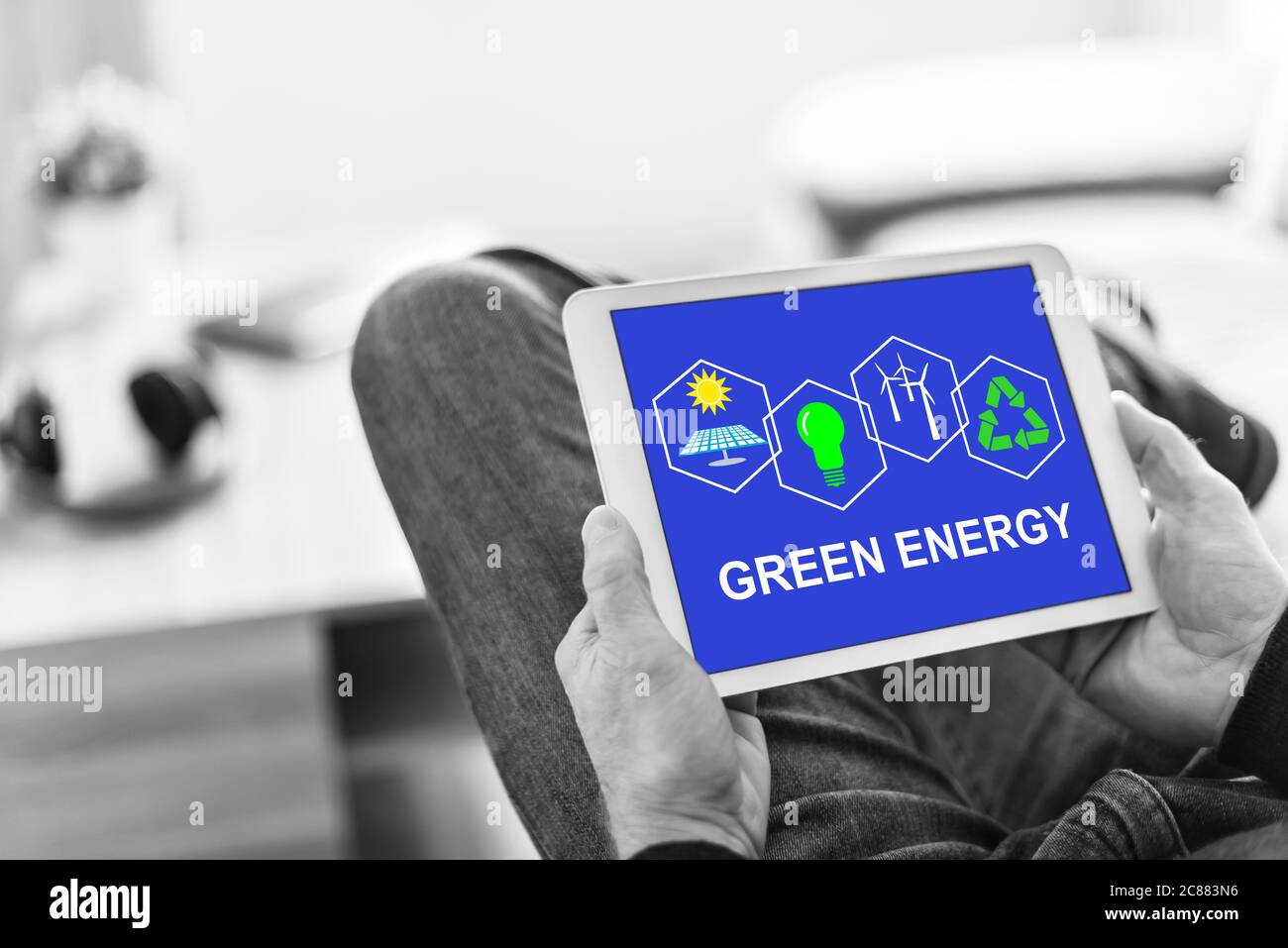 Tablet screen displaying a green energy concept Stock Photo - Alamy