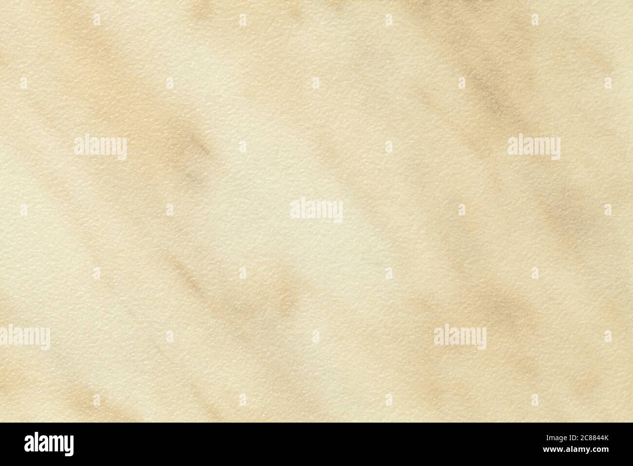Texture of light beige marble with brown lines of a pattern, macro ...