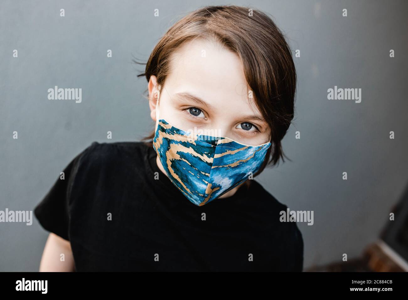 boy child wearing fabric masks during the corona COVID-19 pandemic ...
