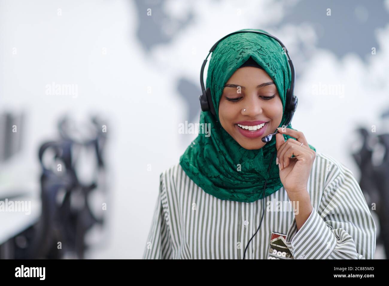 African muslim female with green hijab scarf customer representative ...