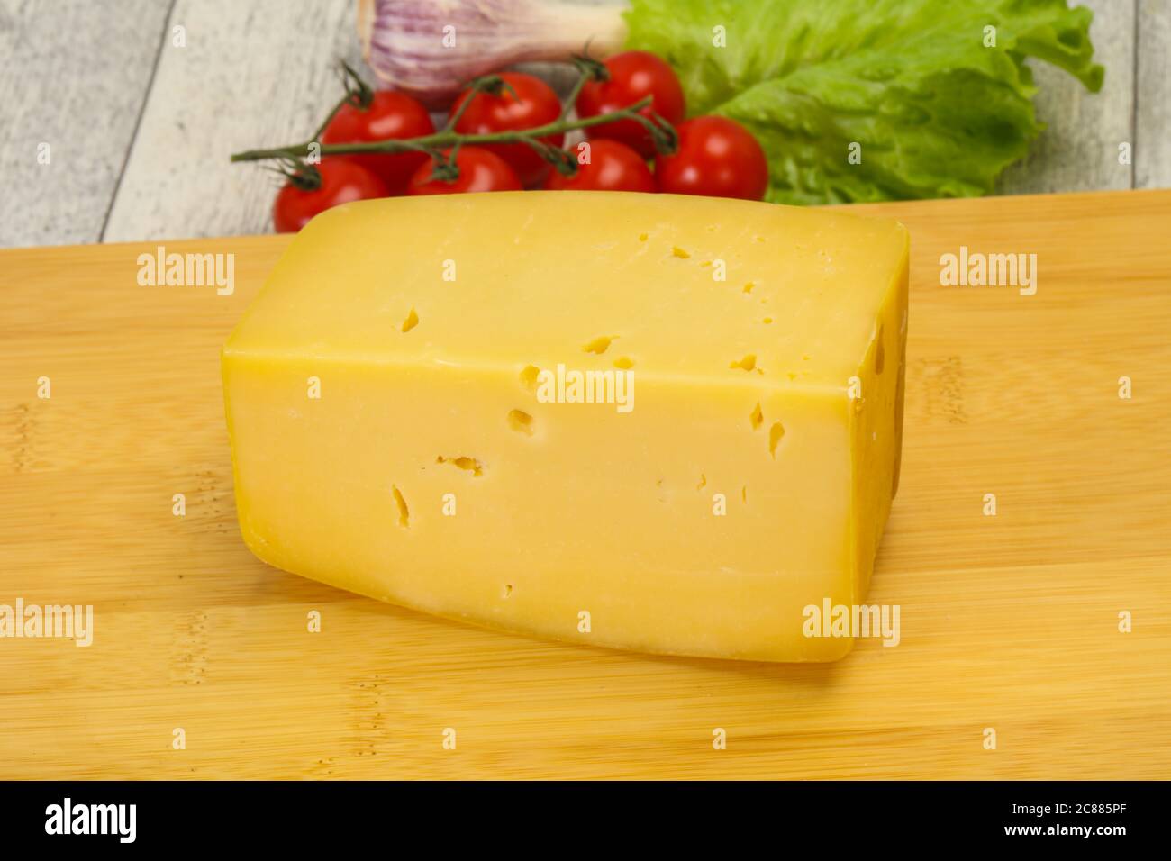 Swiss Hard yellow tasty cheese brick Stock Photo - Alamy