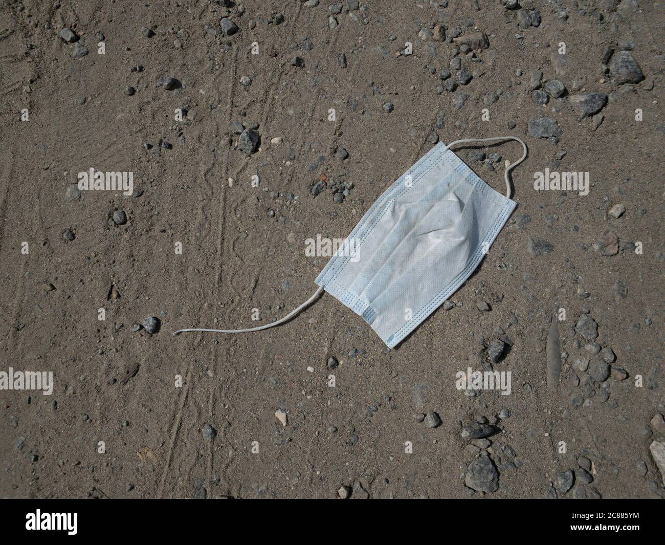 Mask threw on the ground. COVID-19 Stock Photo - Alamy