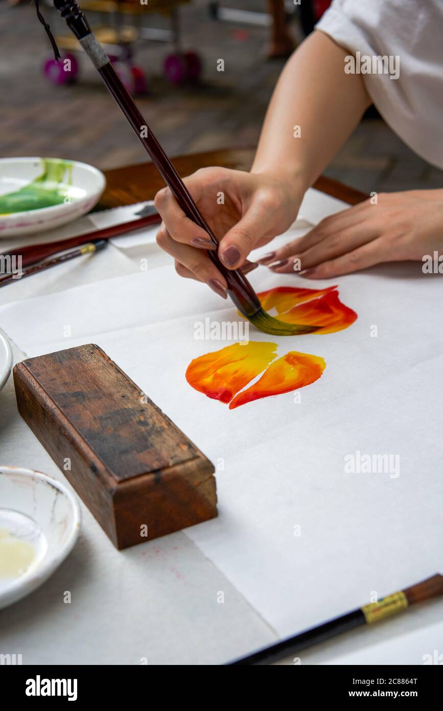 An artist painter is creating traditional Chinese paintings Stock Photo ...