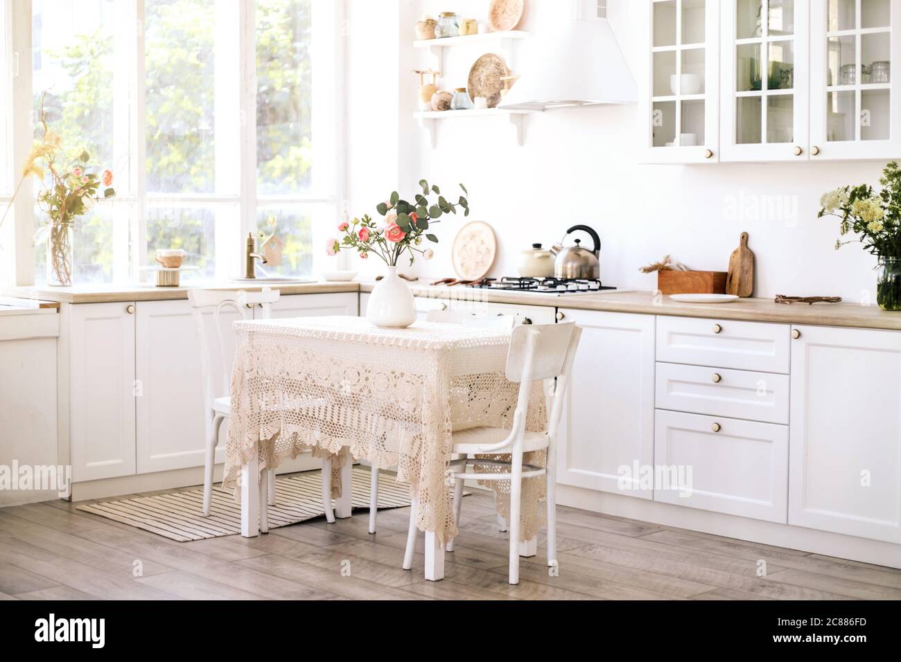 Light modern kitchen in cozy house Stock Photo - Alamy