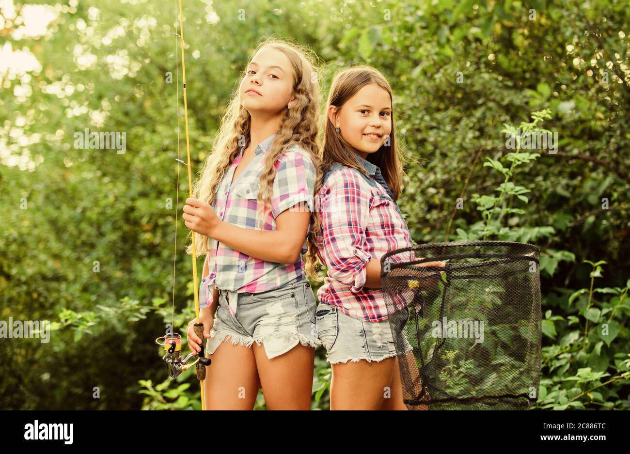 Camping activities. Fly fishing. Kids spend time together fishing ...