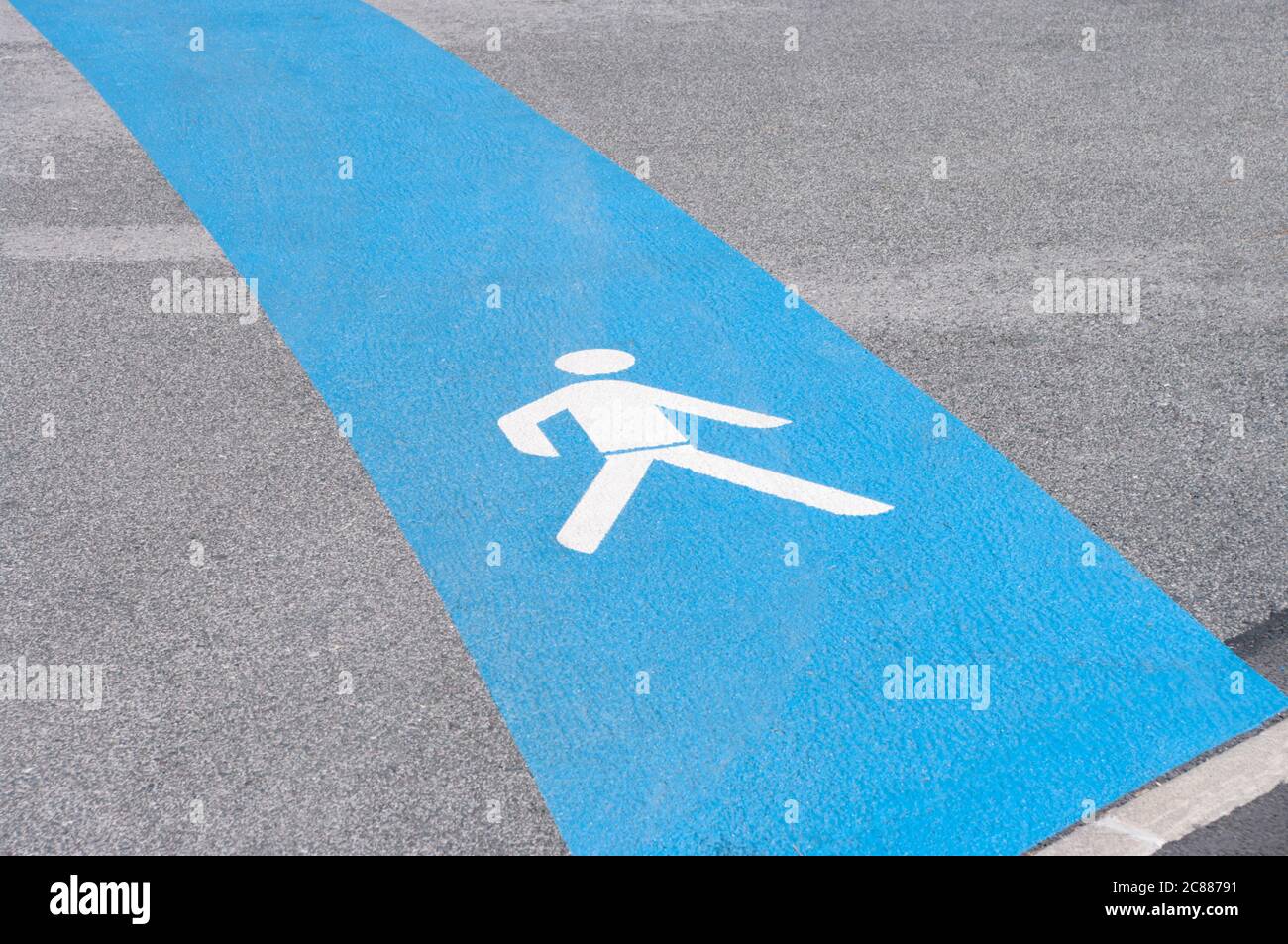 White footpath sign on blue walk way in public park. Outdoor Stock ...