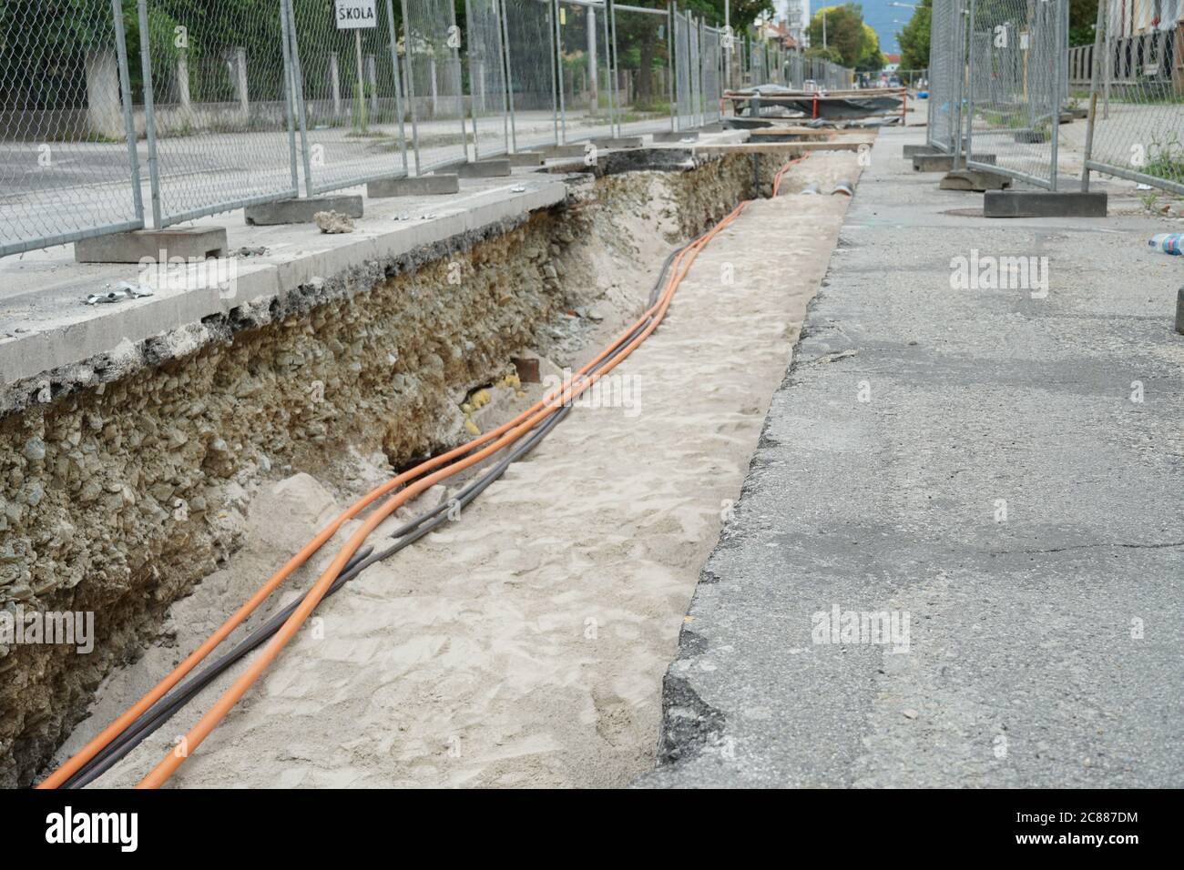 Civil engineering construction ditch with cables and wires. The cross ...