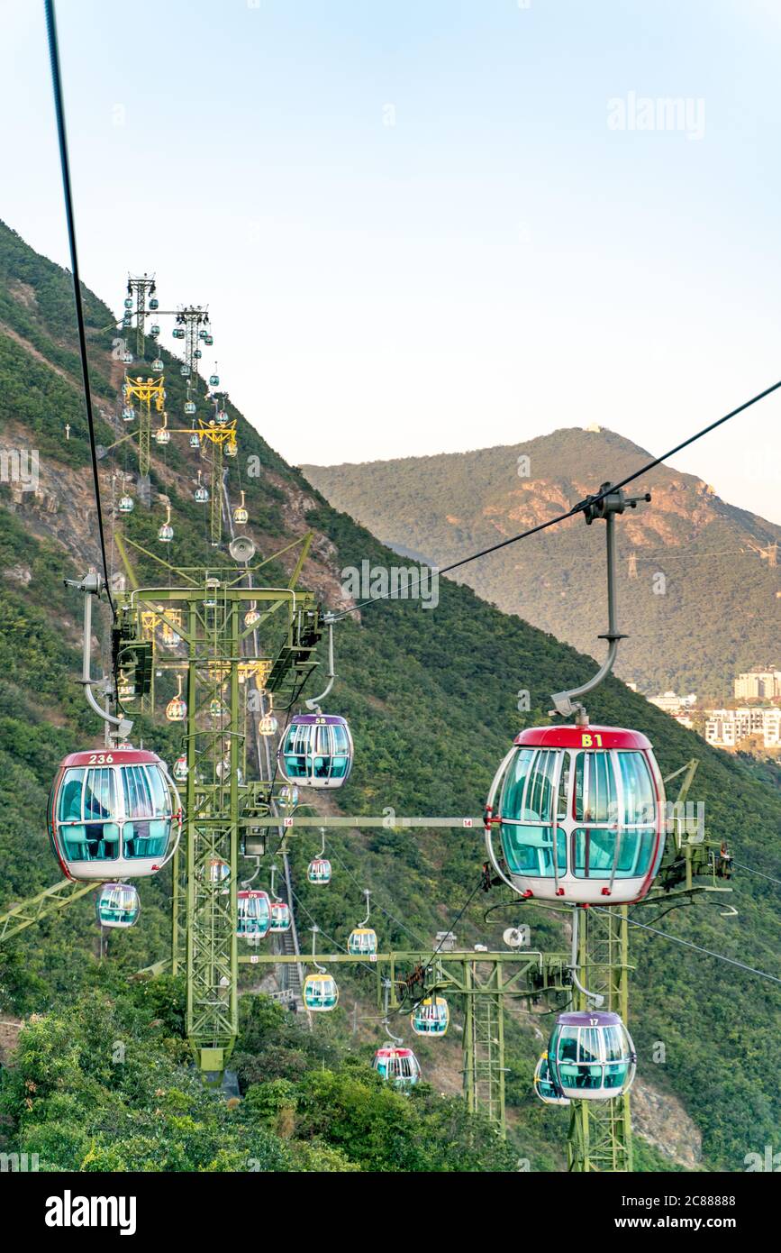 The sunny view of cable car and theme park near to ocean Stock Photo ...
