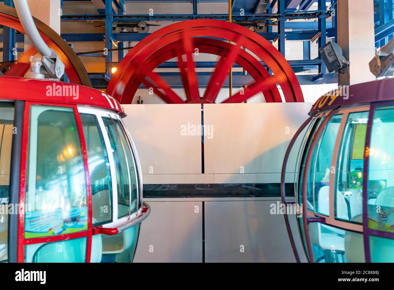 The sunny view of cable car and theme park near to ocean Stock Photo ...