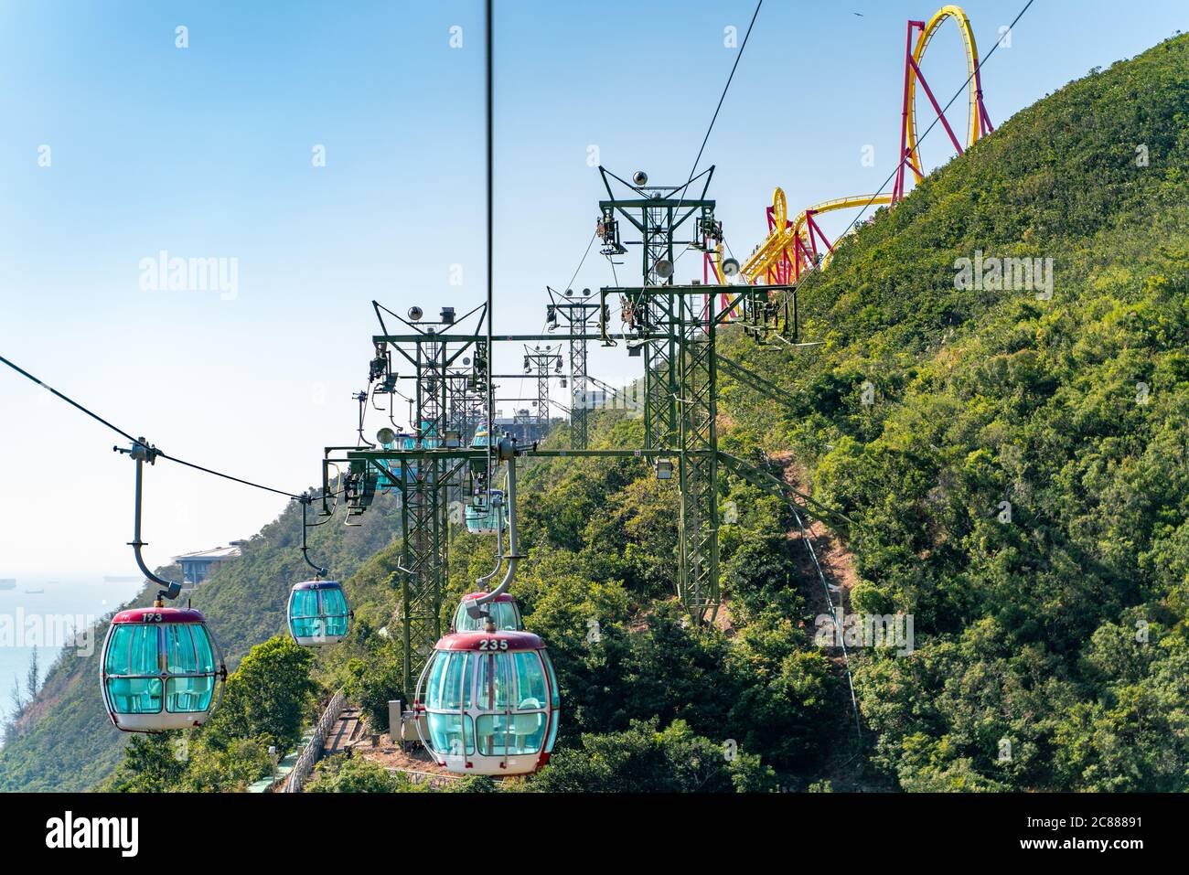 The sunny view of cable car and theme park near to ocean Stock Photo ...