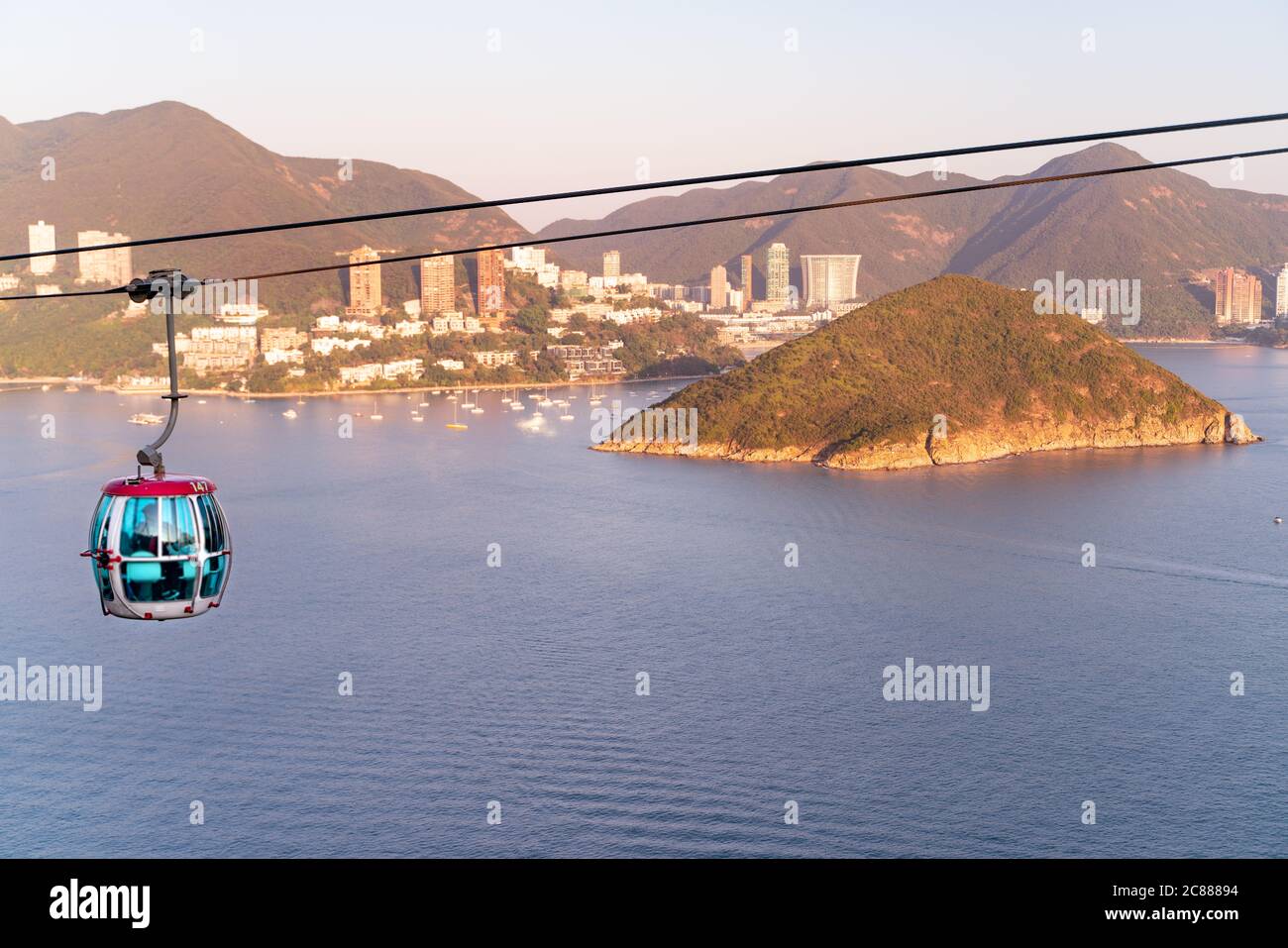 The sunny view of cable car and theme park near to ocean Stock Photo ...