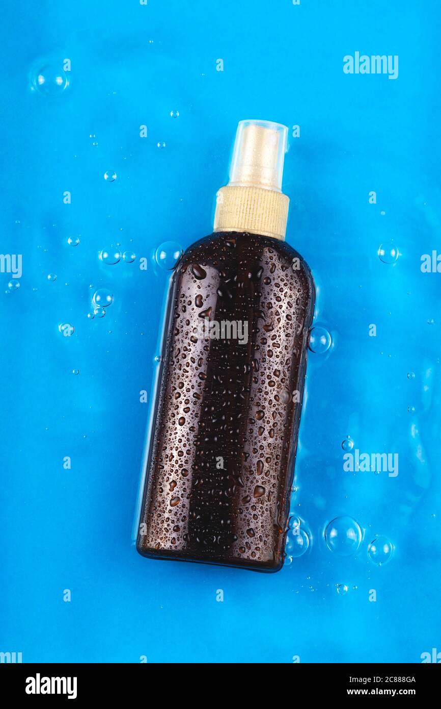 Sunscreen for skin care in the pool water Stock Photo - Alamy