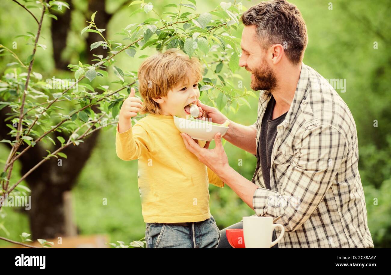 family and parenting. son and father eating. happy fathers day. Little ...