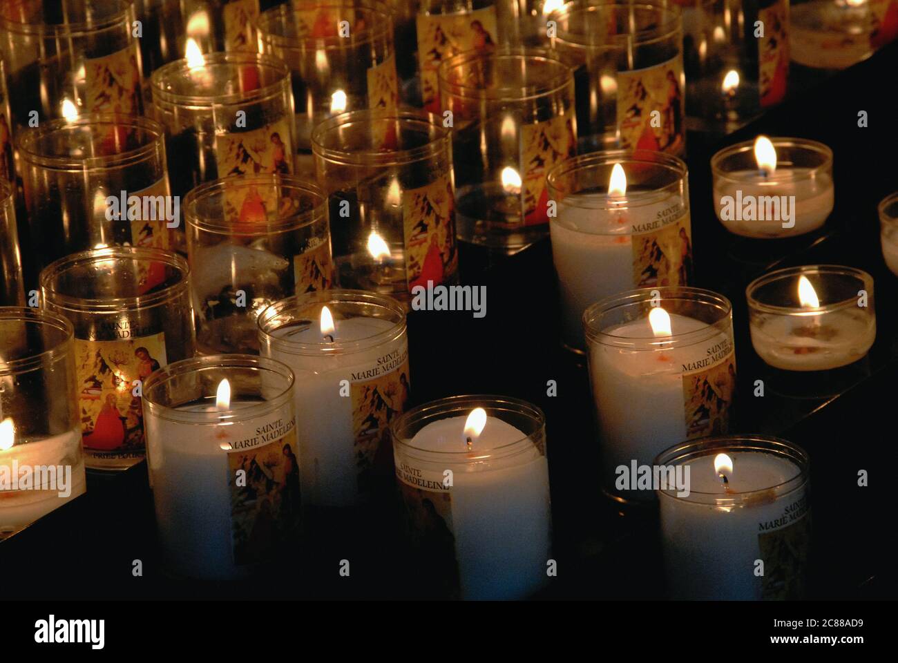 Votive candles alight hi-res stock photography and images - Alamy