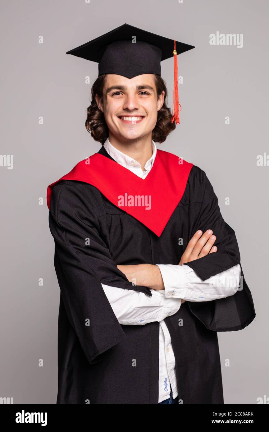 Young graduation man on white background Stock Photo - Alamy