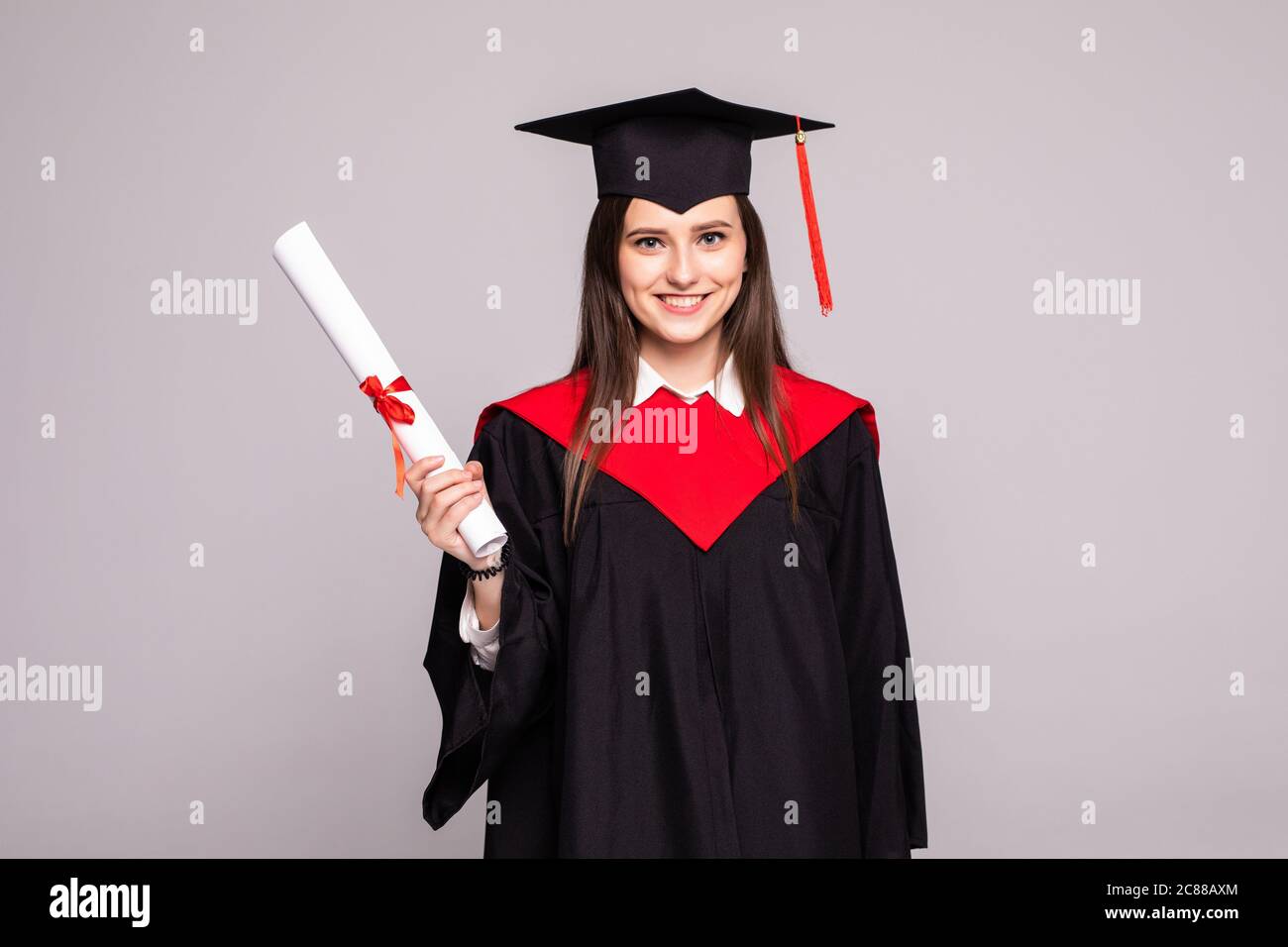 Educational theme: graduating student girl in an academic gown ...