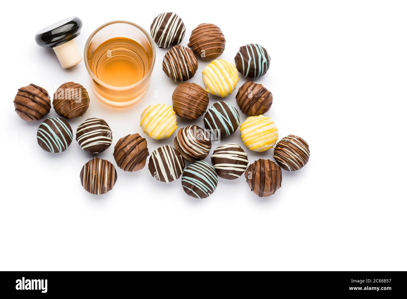 assorted filled chocolates confectionery with liquor glass and copy ...
