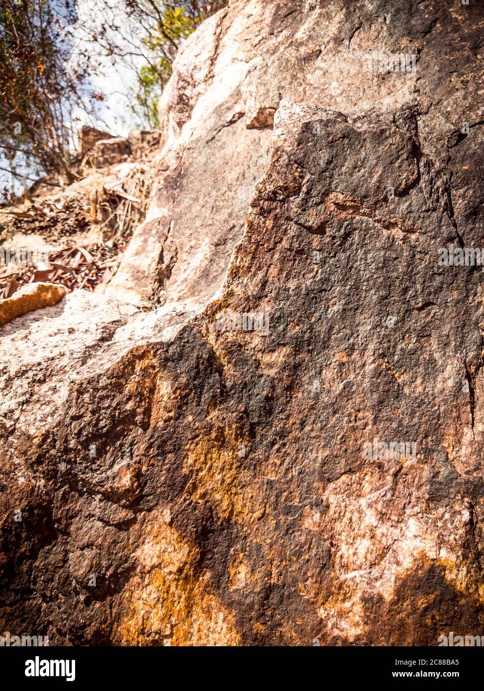 Natural background. Closeup edged shabby cliff cracks. Gray-brown stone ...
