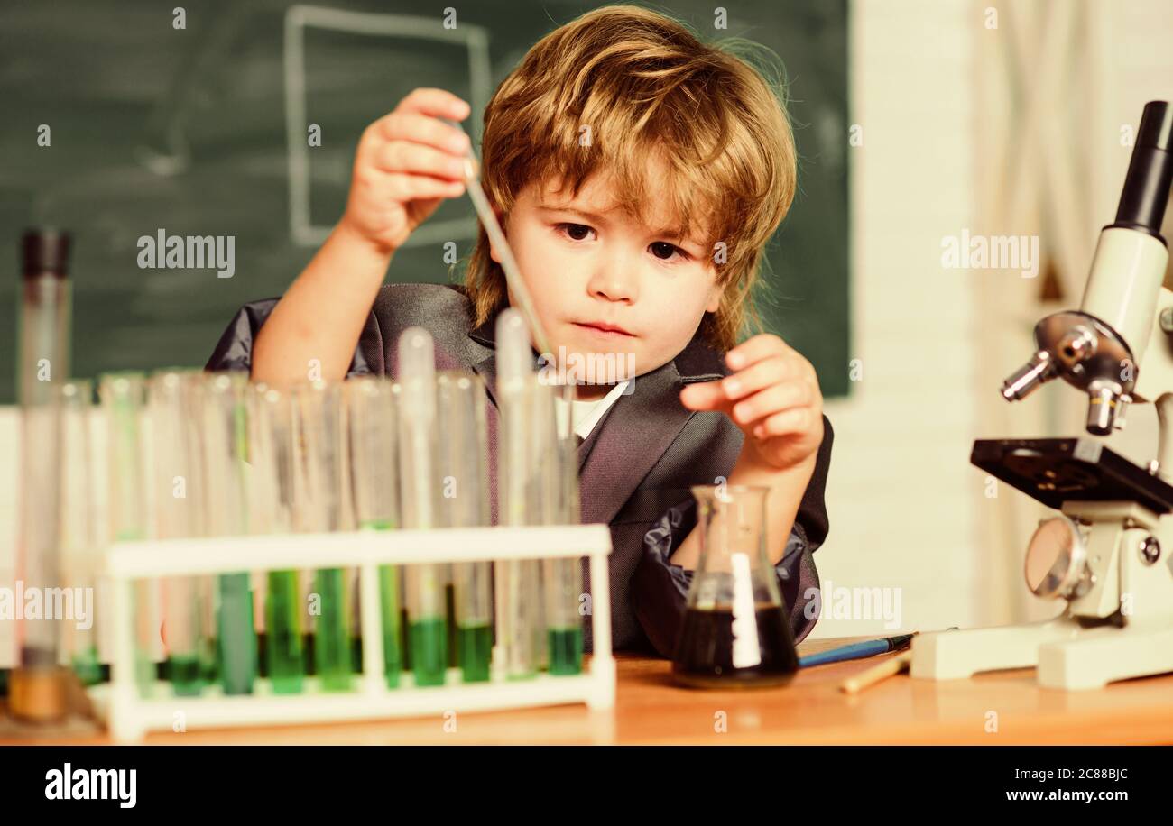 little boy at lesson. Back to school. Little kid learning chemistry in ...