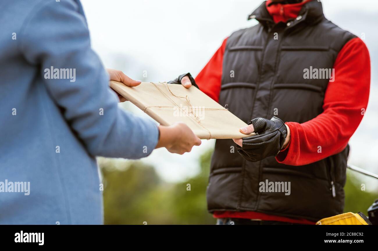 Delivery Courier Guy Giving Parcel To Unrecognizable Customer Outdoors ...