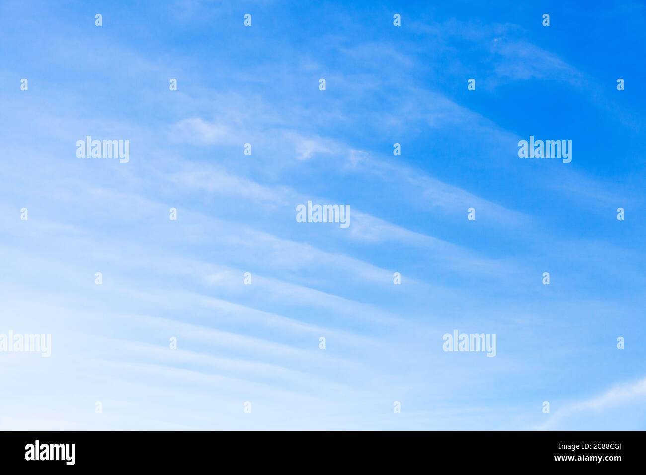Stripes of windy clouds in the blue sky at daytime, natural photo ...