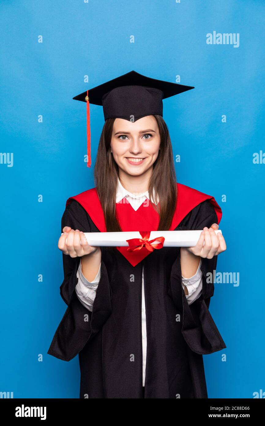Beautiful woman wearing a blue graduation gown holding a diploma and ...
