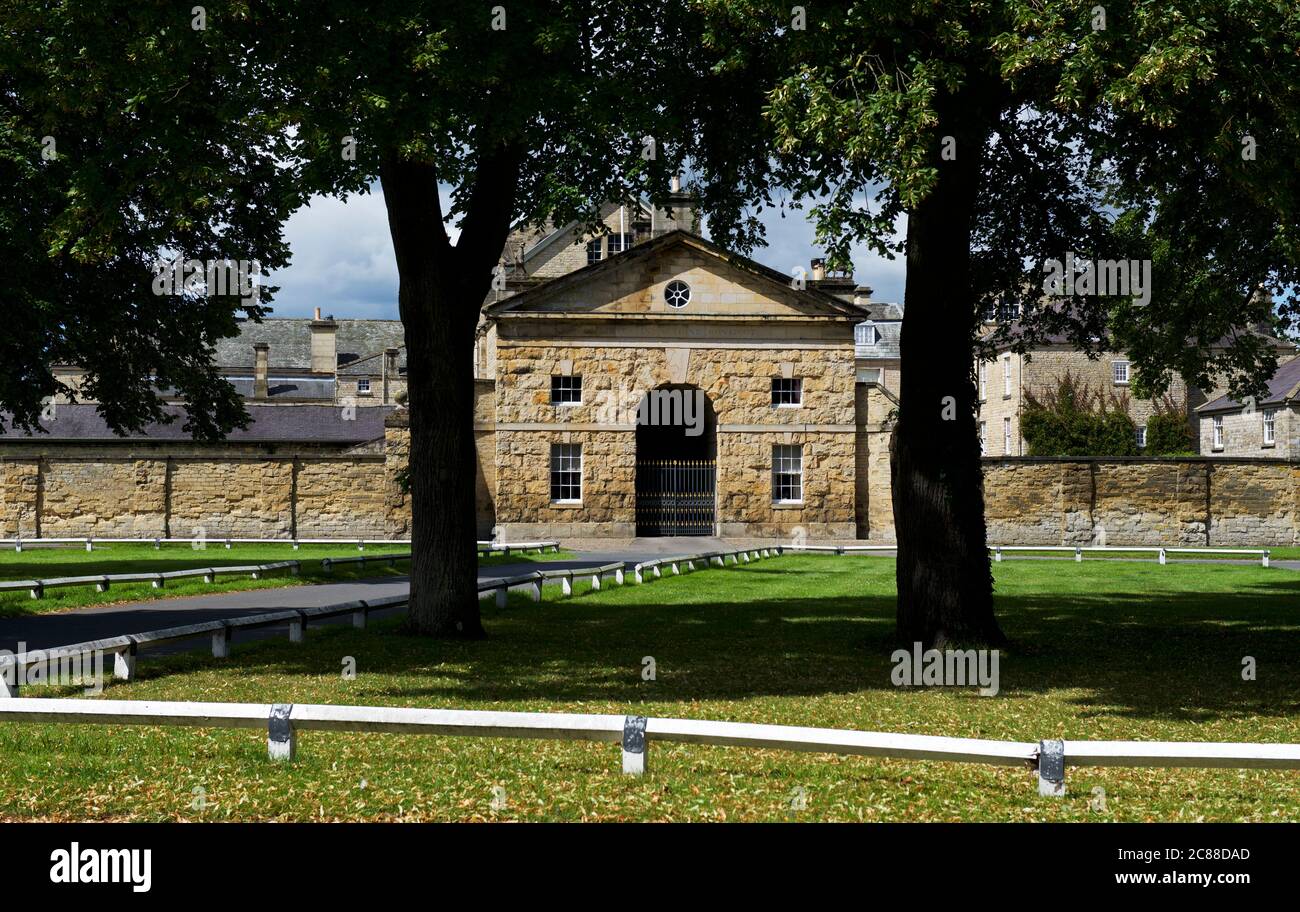 Entrance to the stable block of Hovingham Hall, in the estate village ...