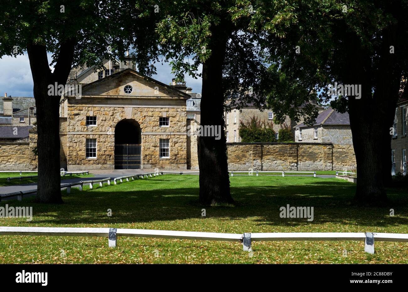Entrance to the stable block of Hovingham Hall, in the estate village ...