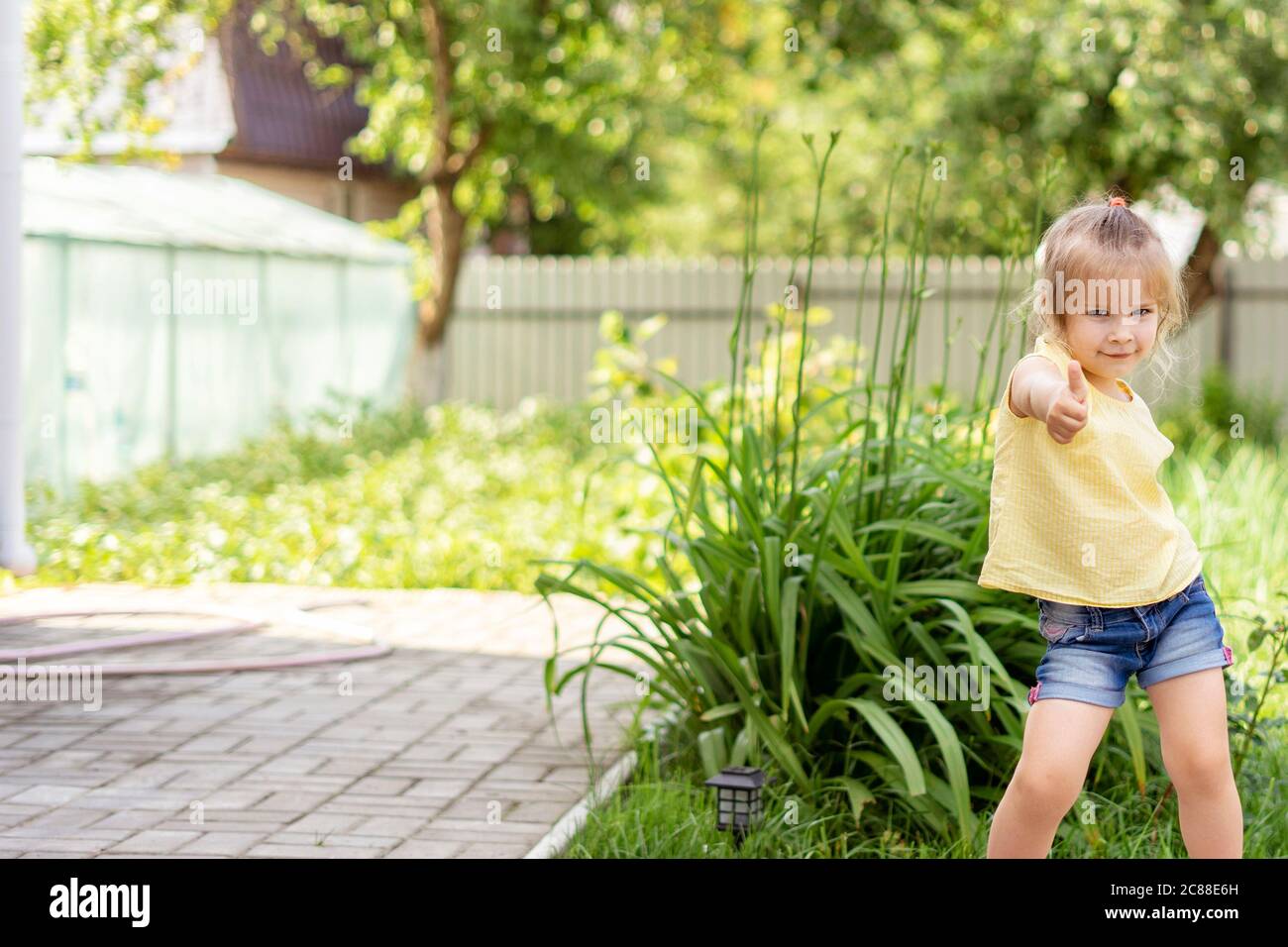 Little girl dances in the country. dancing in nature Stock Photo - Alamy