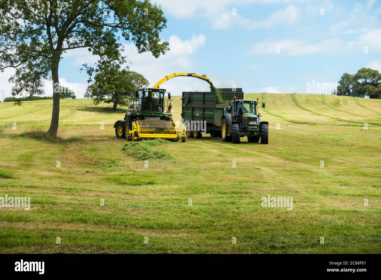 Farmer collecting grass for Silage, Somerset, England, UK Stock Photo ...
