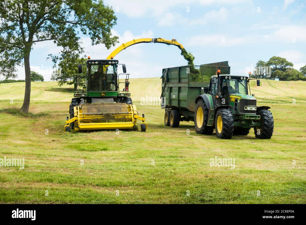 Farmer collecting grass for Silage, Somerset, England, UK Stock Photo ...