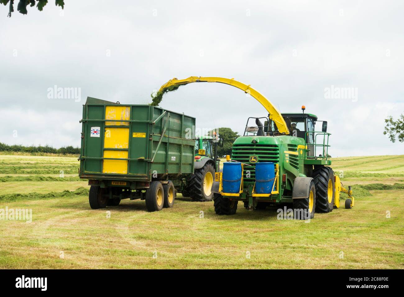 Farmer collecting grass for Silage, Somerset, England, UK Stock Photo ...