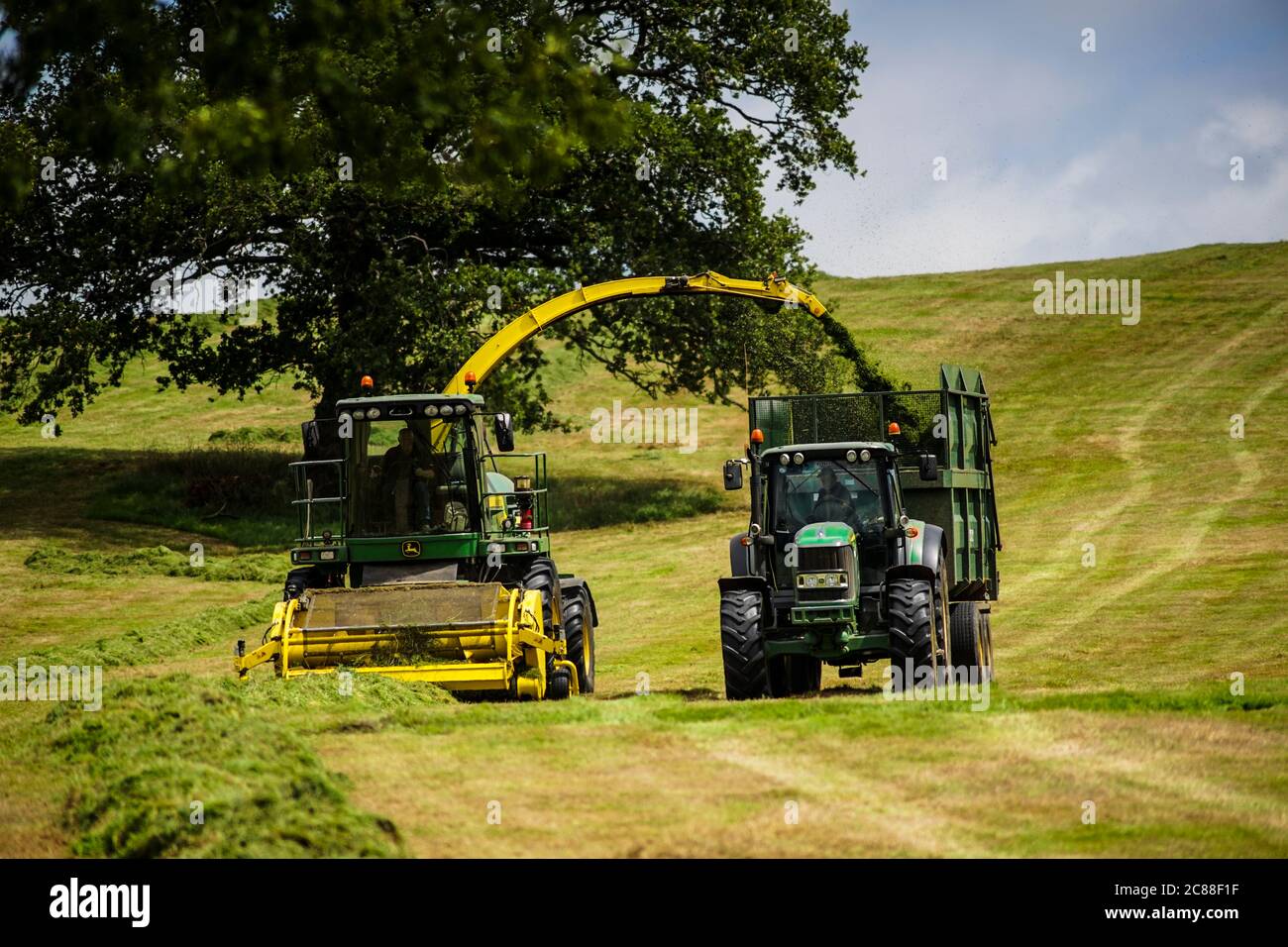 Farmer collecting grass for Silage, Somerset, England, UK Stock Photo ...