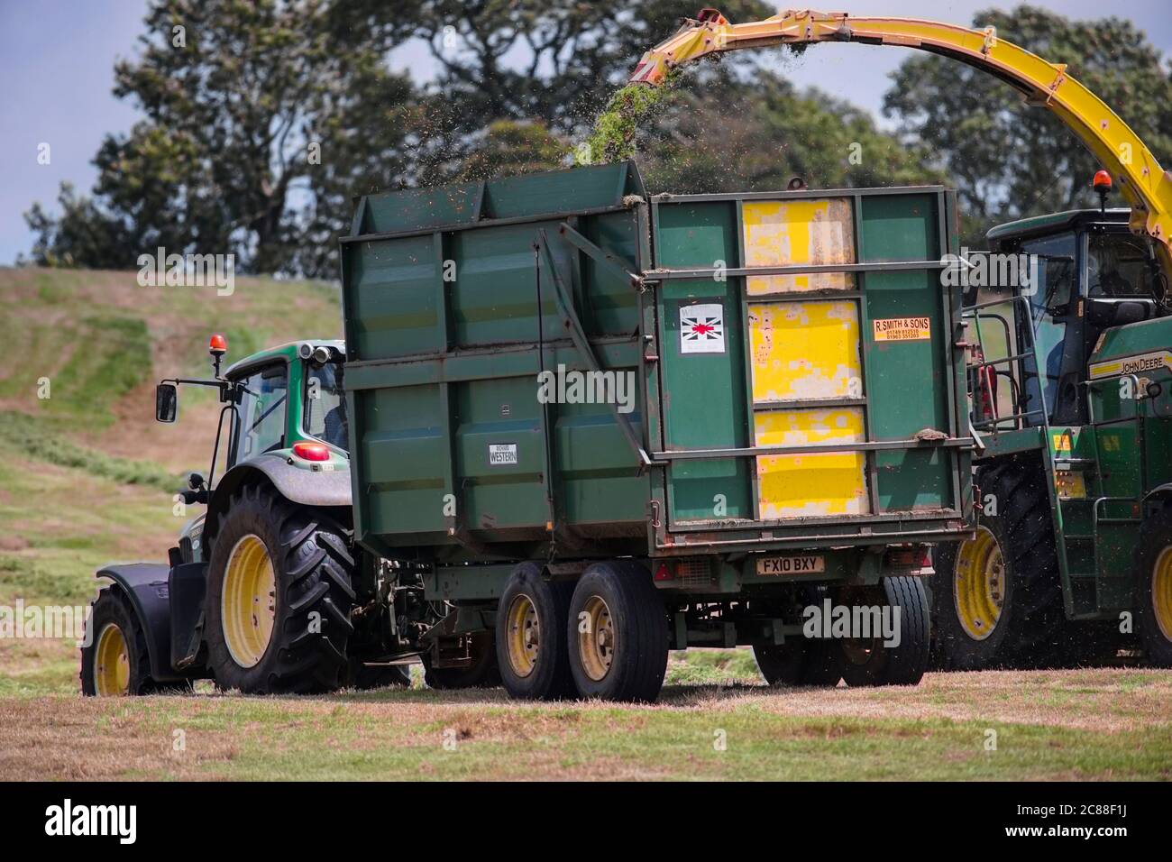 Farmer collecting grass for Silage, Somerset, England, UK Stock Photo ...