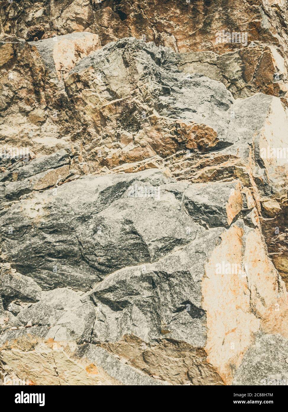 Natural background. Closeup edged shabby cliff cracks. Gray-brown stone ...