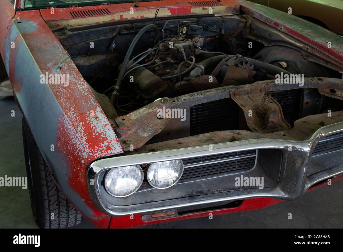 Photo of a muscle car to be restored. Taken from the front. Its ...